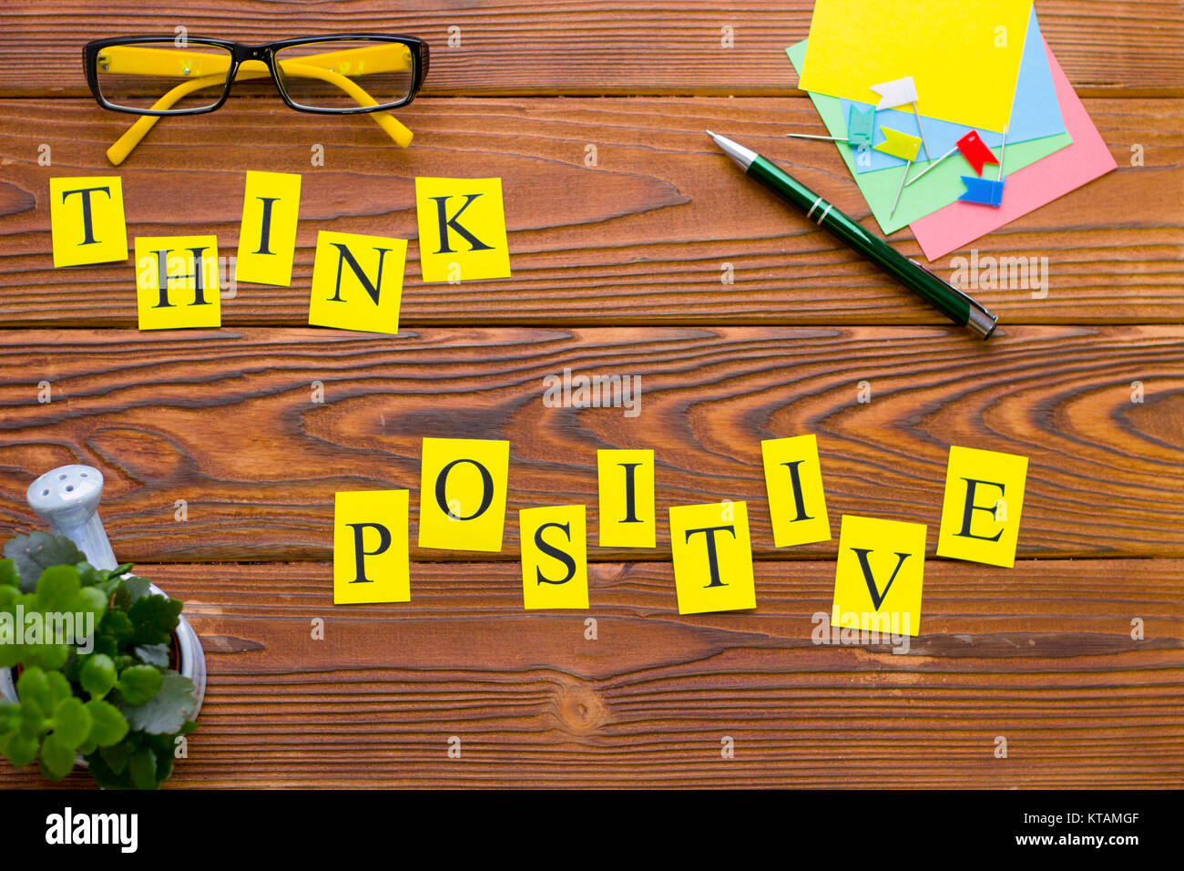 Think positive checkered inscription with office accessories, top view ...