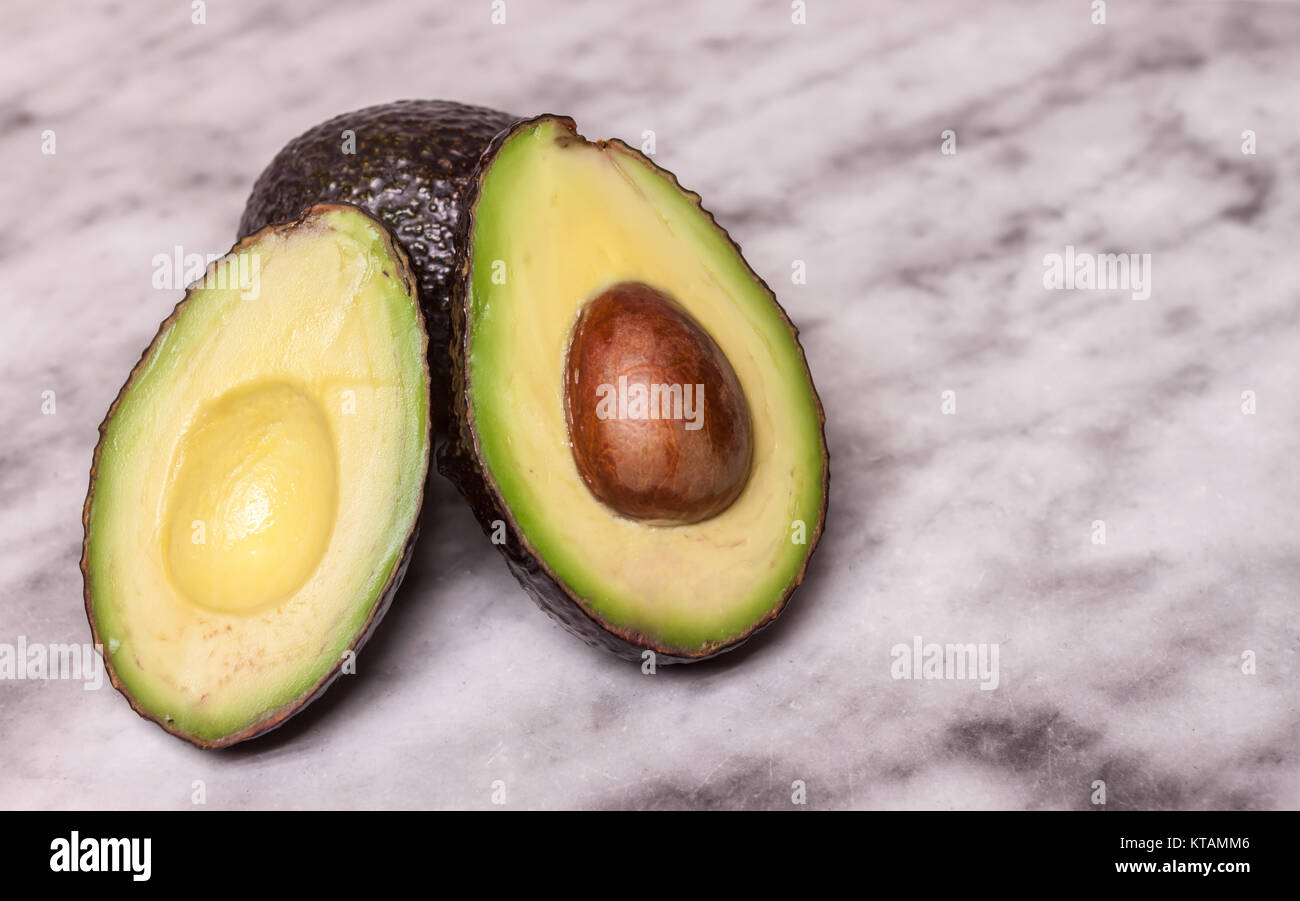 avocado on marble surface Stock Photo - Alamy