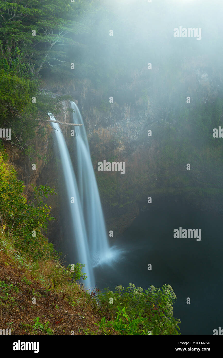 Wailua Falls in the mist at sunrise in the island of Kauai, Hawaii. USA ...