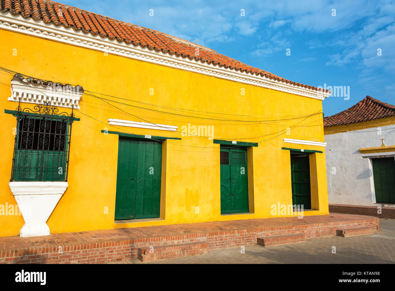 Yellow and Green Colonial Architecture Stock Photo - Alamy