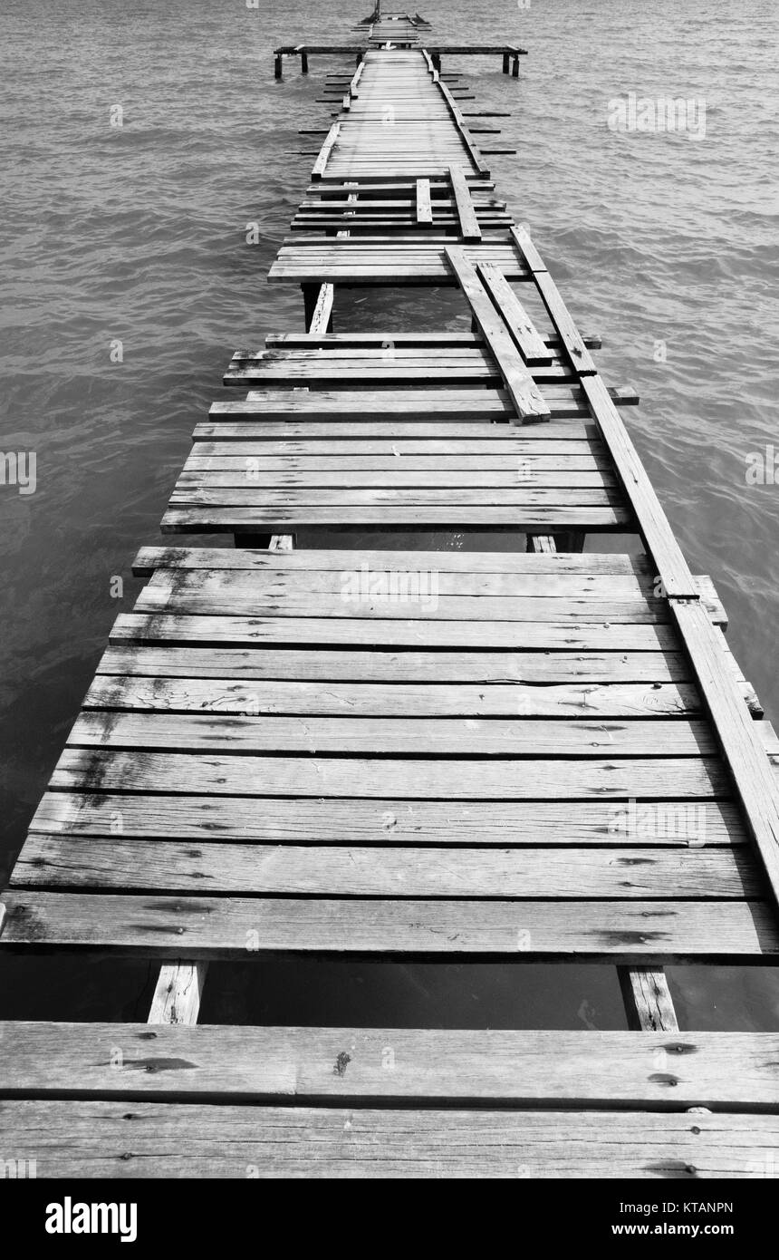 Wooden pier on the sea background Stock Photo - Alamy