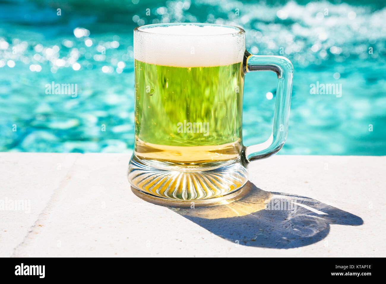 mug of cold beer on the outdoor pool Stock Photo - Alamy