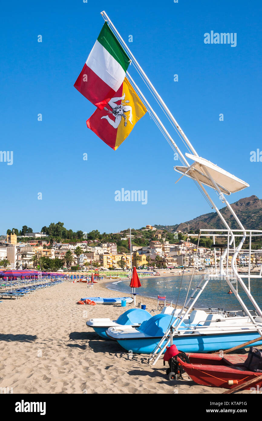 Italian flags over beach of Giardini Naxos Stock Photo - Alamy