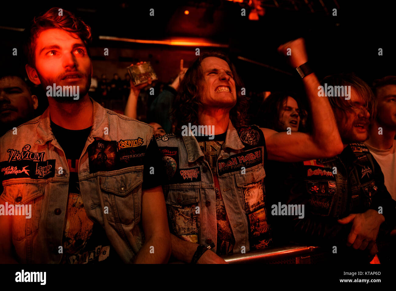 Heavy metal fans attend a live concert with the German thrash metal ...
