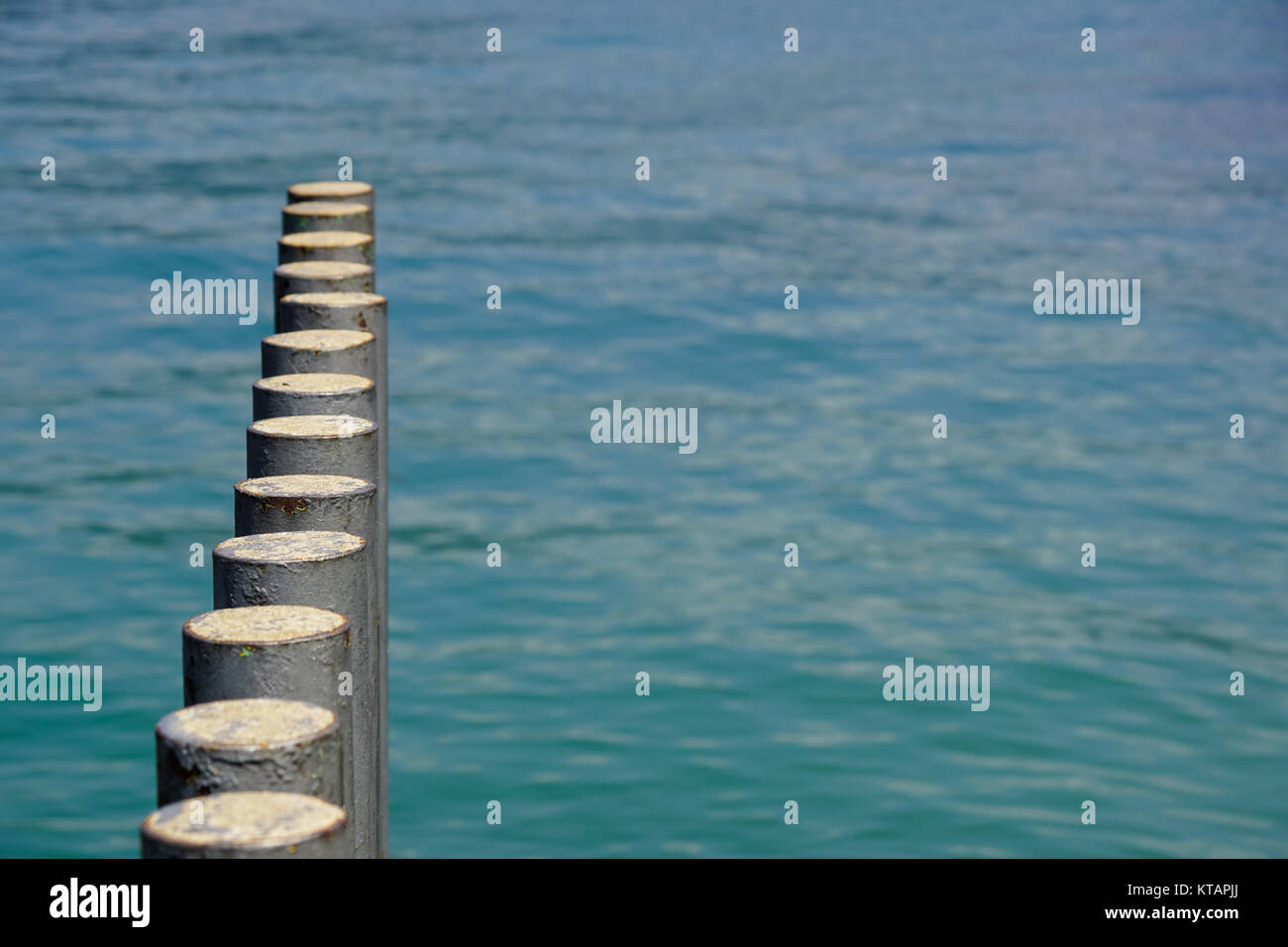 Old pier poles Stock Photo - Alamy