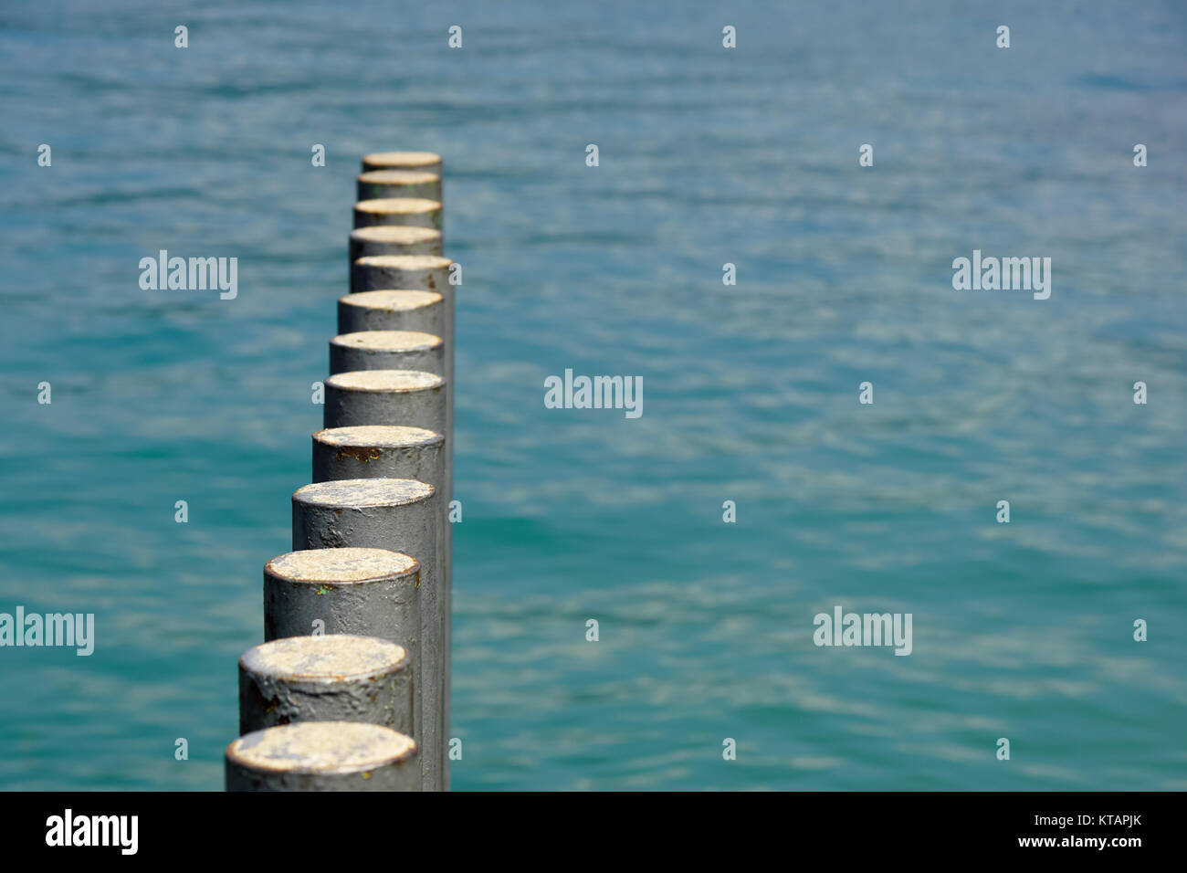 Old pier poles Stock Photo - Alamy