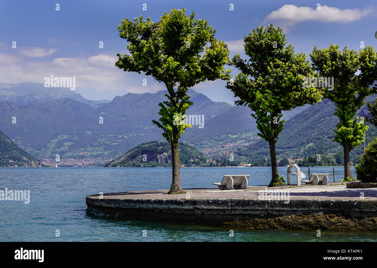 View of italy lake , with park, lake and mountain views Stock Photo - Alamy