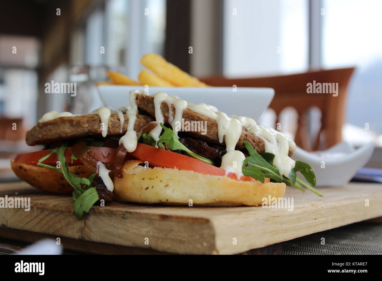Burger and chips for lunch - hungry anyone Stock Photo - Alamy