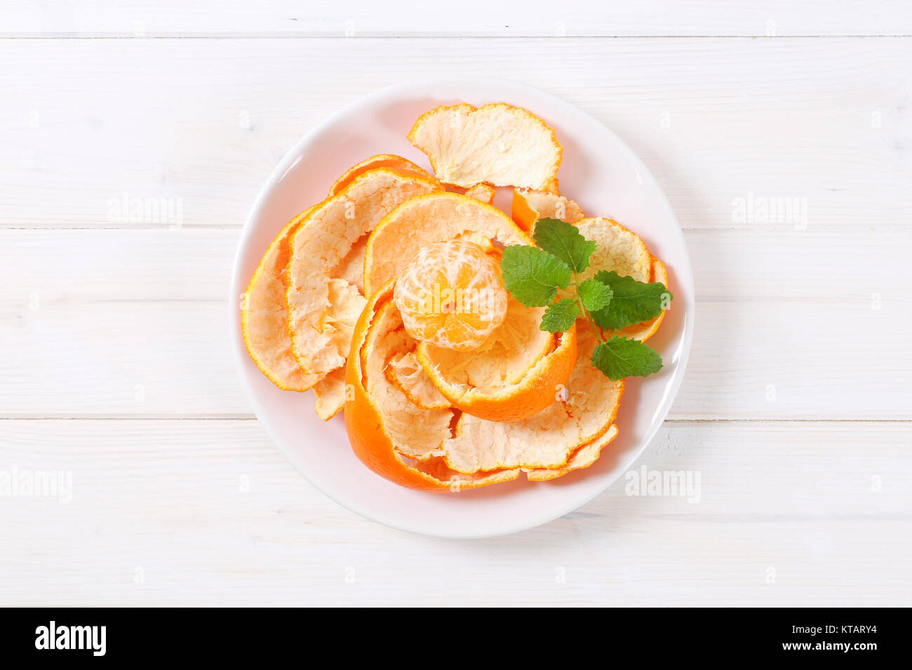 peeled tangerine arranged in peels Stock Photo - Alamy