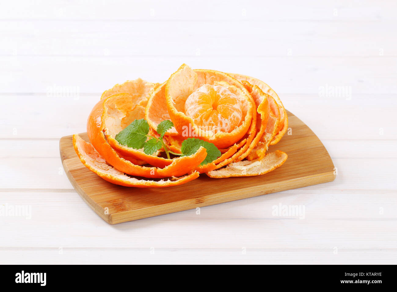 peeled tangerine arranged in peels Stock Photo - Alamy