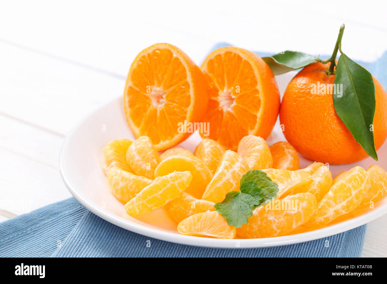 whole and sliced tangerines Stock Photo - Alamy