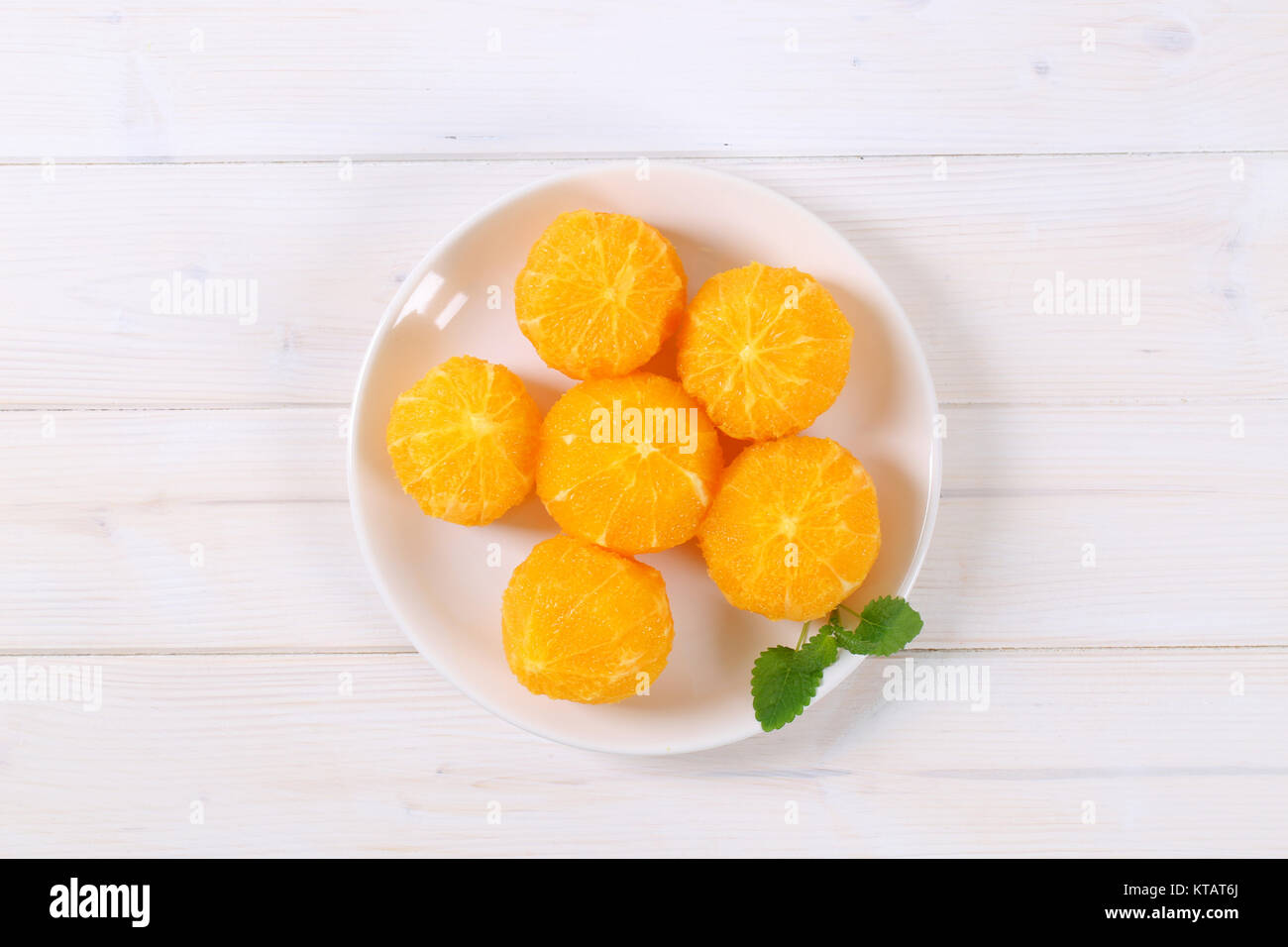 whole and peeled oranges Stock Photo - Alamy