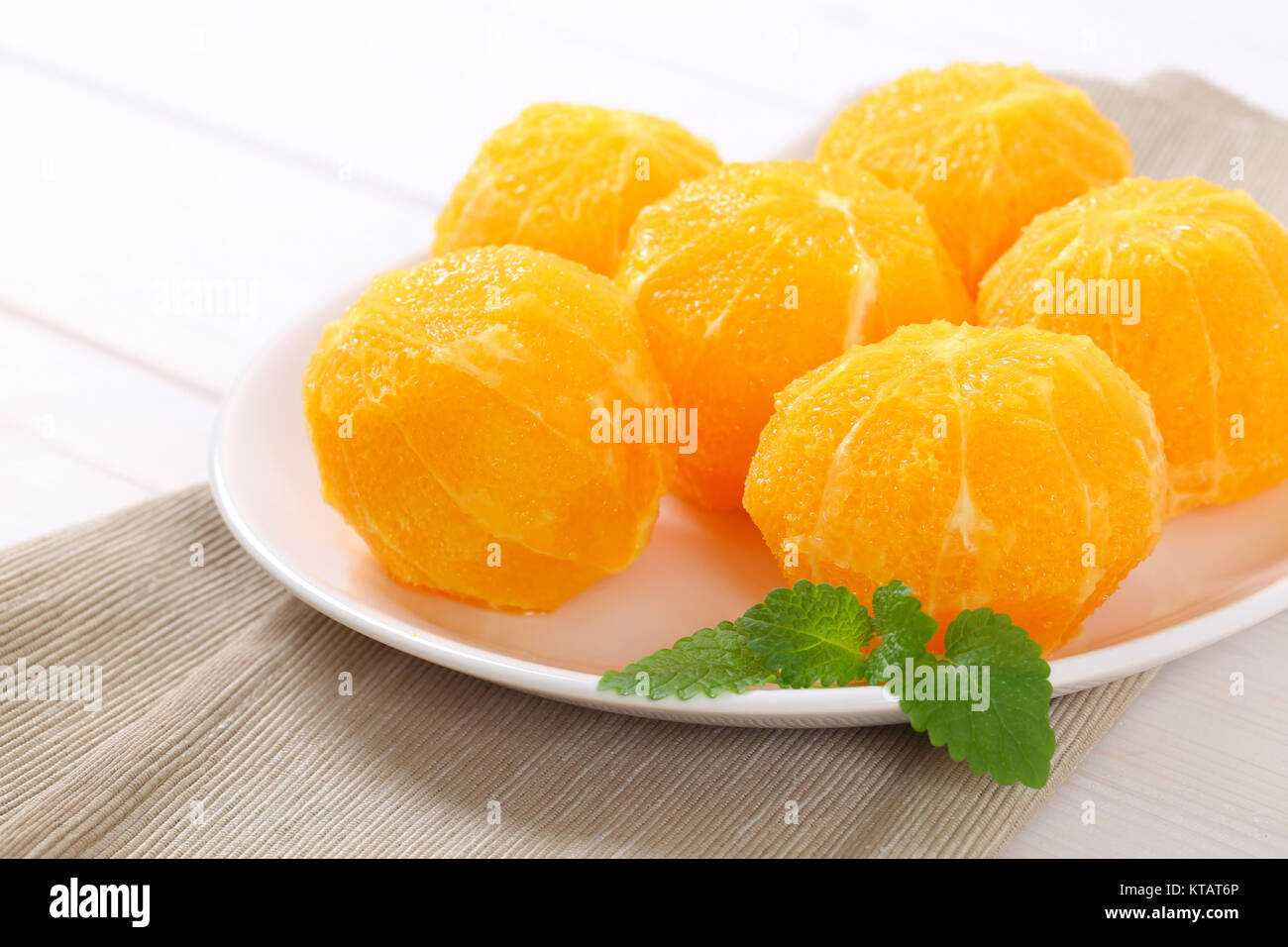 whole and peeled oranges Stock Photo - Alamy