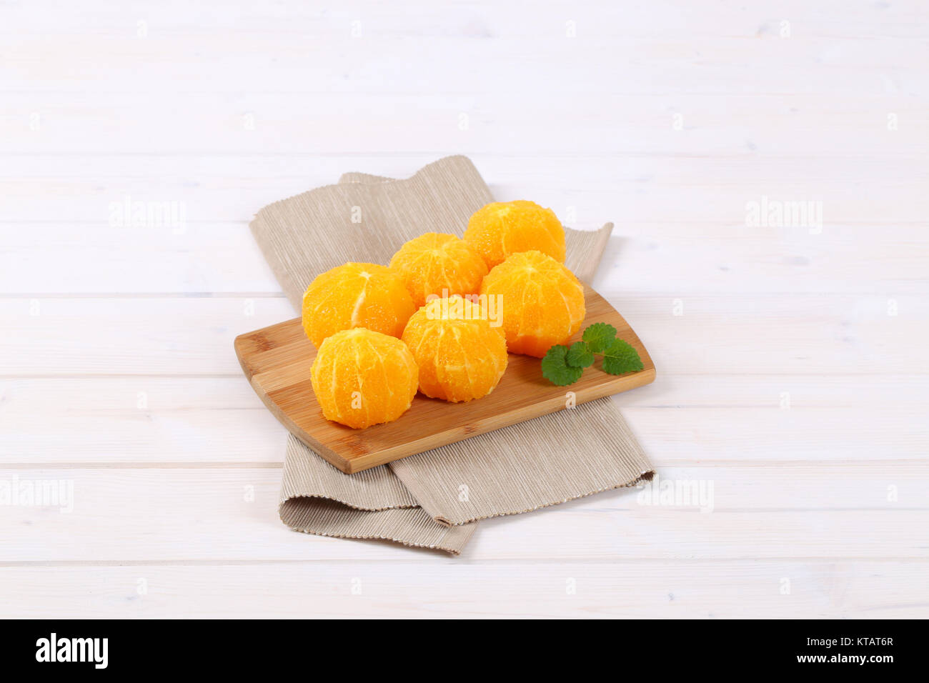 whole and peeled oranges Stock Photo - Alamy