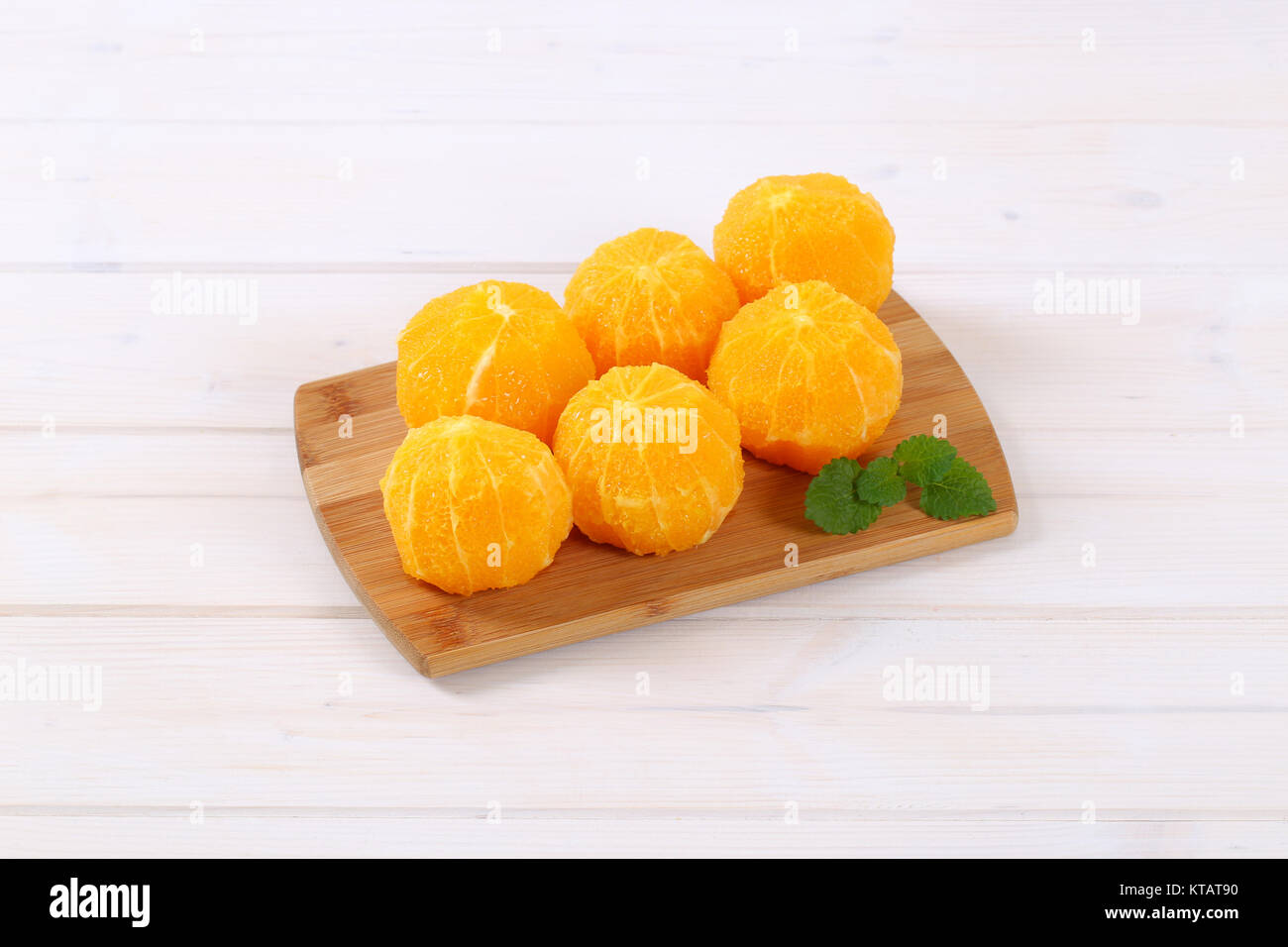 whole and peeled oranges Stock Photo - Alamy