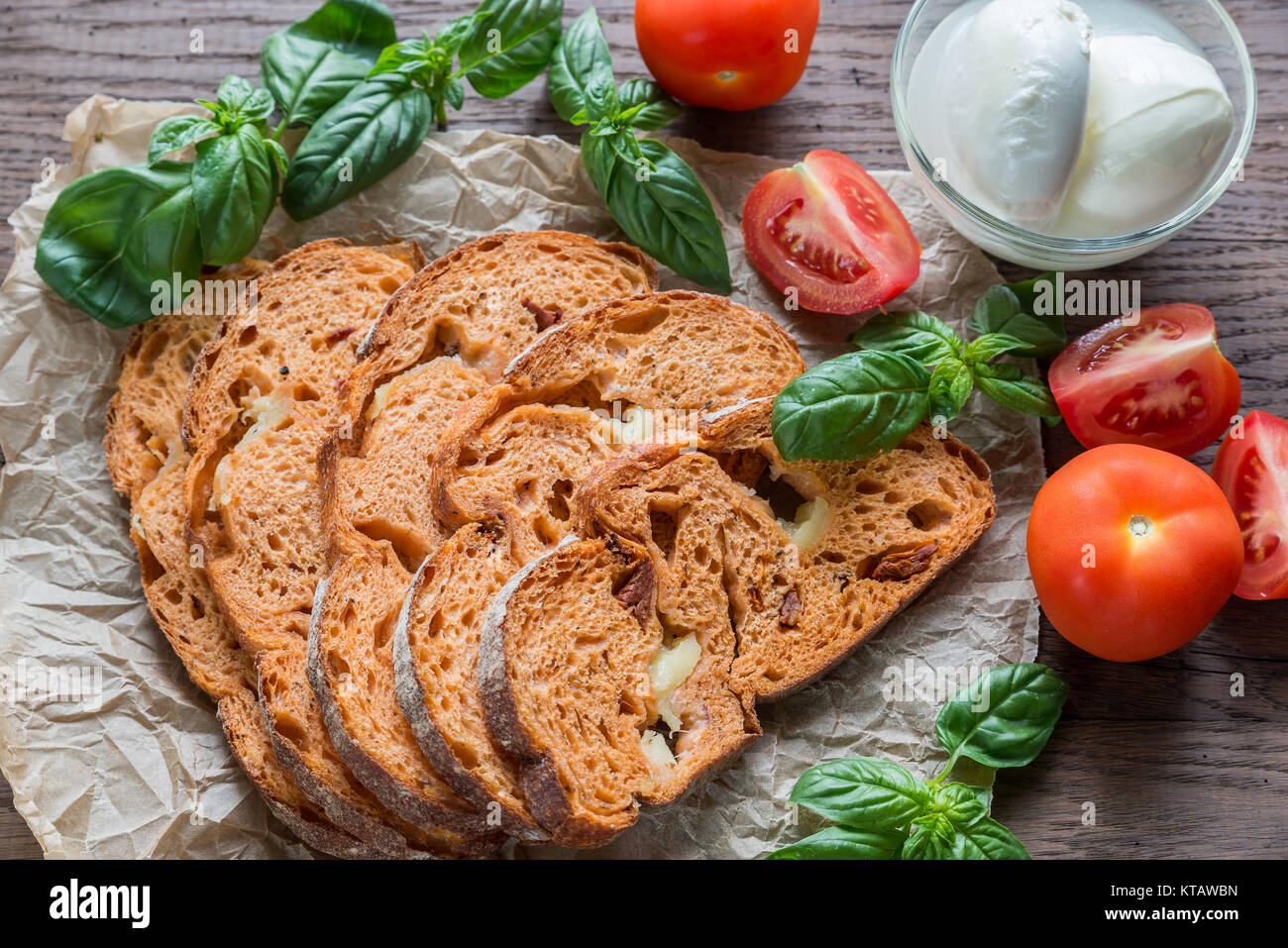 Slices of tomato bread with mozzarella Stock Photo - Alamy