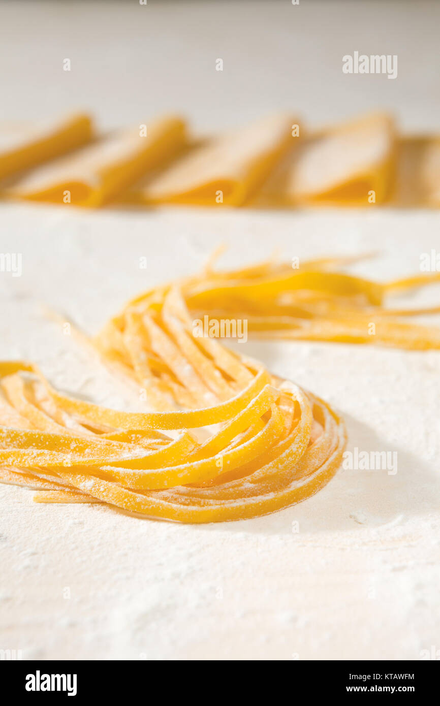 Fresh uncooked tagliatelle pasta Stock Photo - Alamy