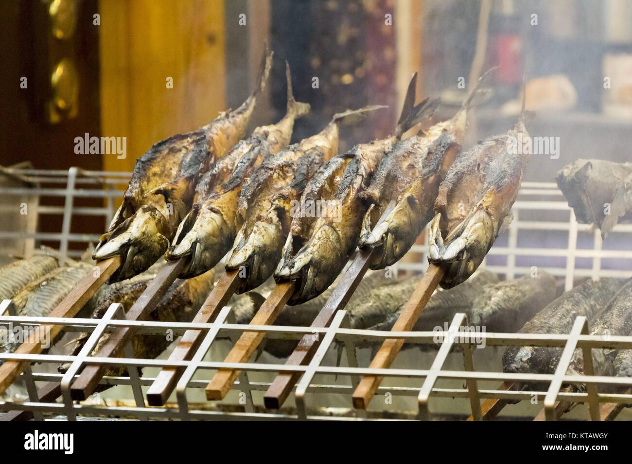 barbecue stockfish grilled trout fish on stock with fire smoke Stock ...