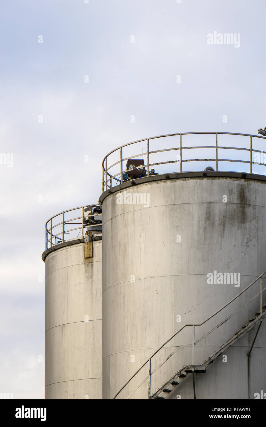 industrial silos against the gray sky Stock Photo - Alamy