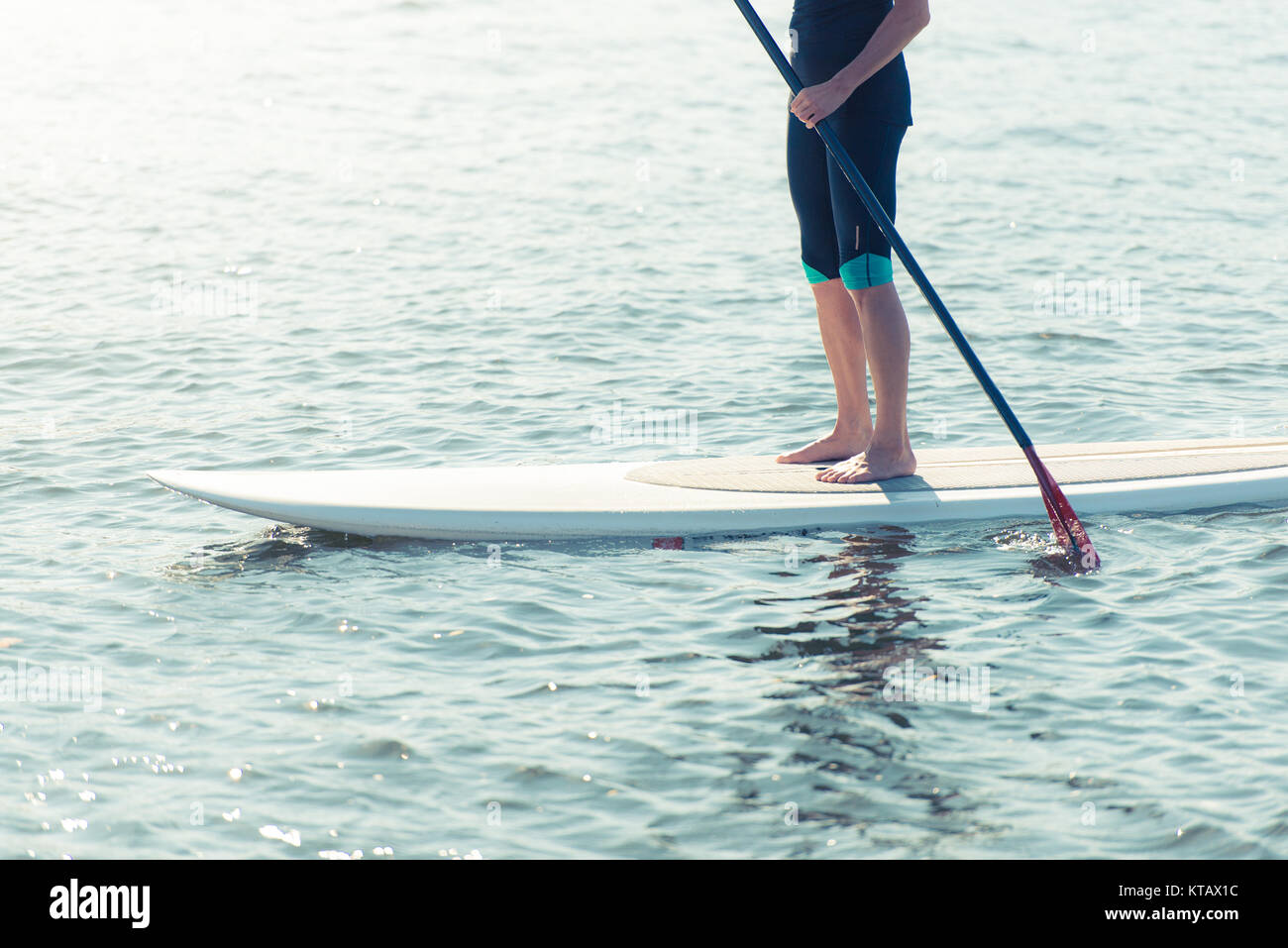 Man on paddleboard Stock Photo - Alamy