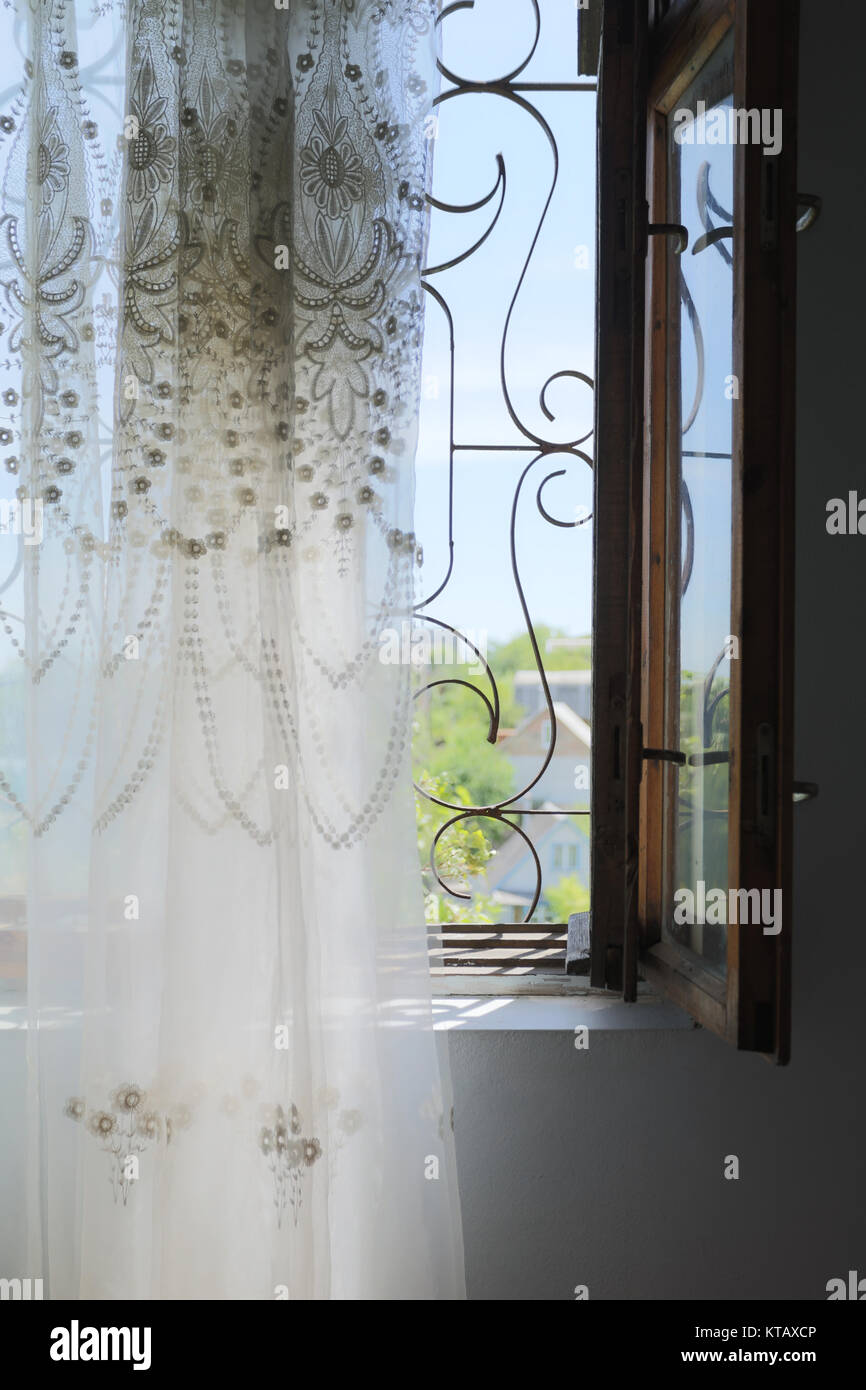 Wooden open window with curtains and lattice Stock Photo - Alamy