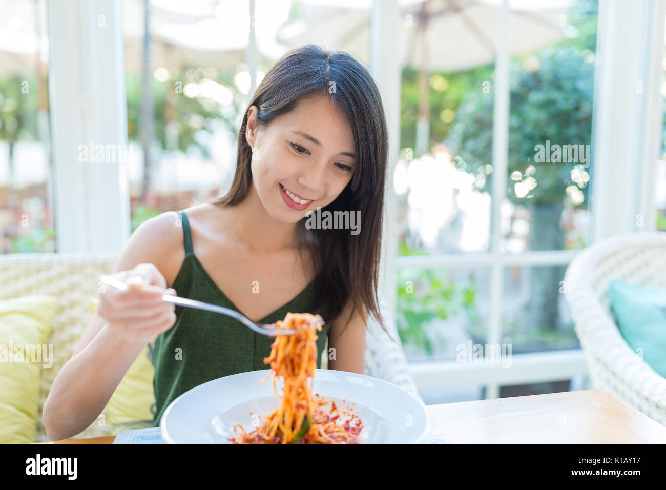 Woman enjoy her spaghetti in restaurant Stock Photo - Alamy
