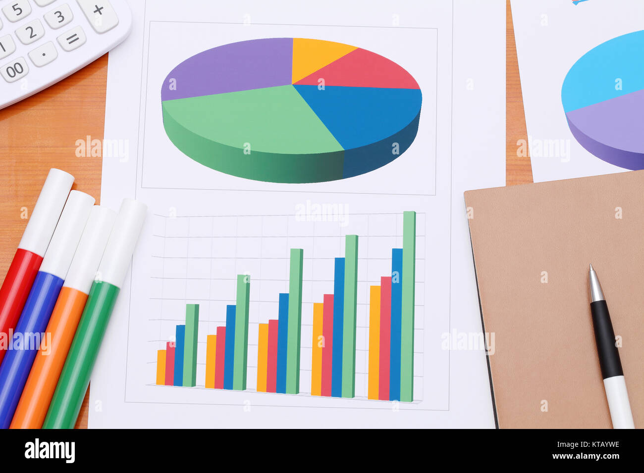 Color chart printed documents with pen and notebook Stock Photo - Alamy
