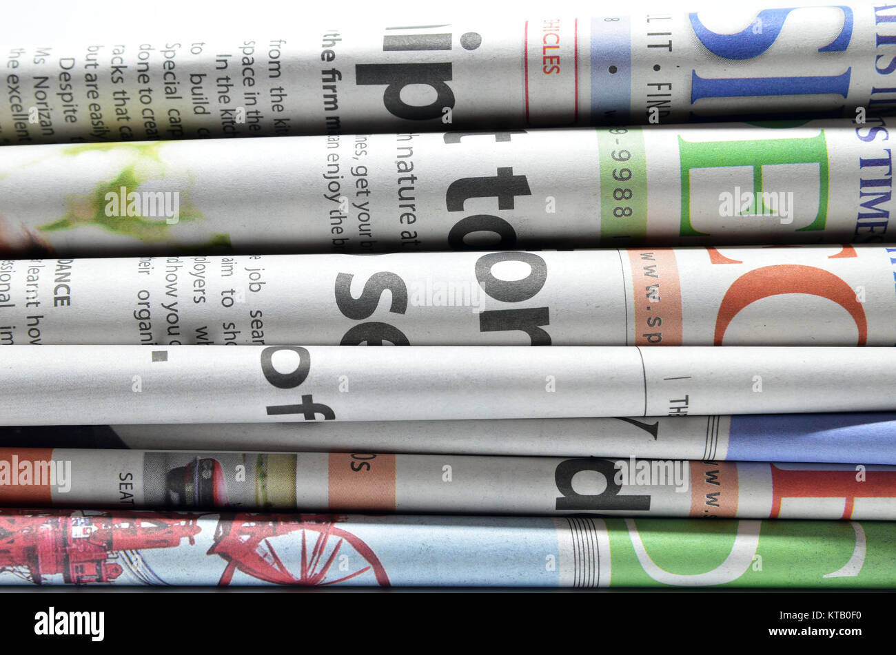 Newspapers folded and stacked Stock Photo - Alamy