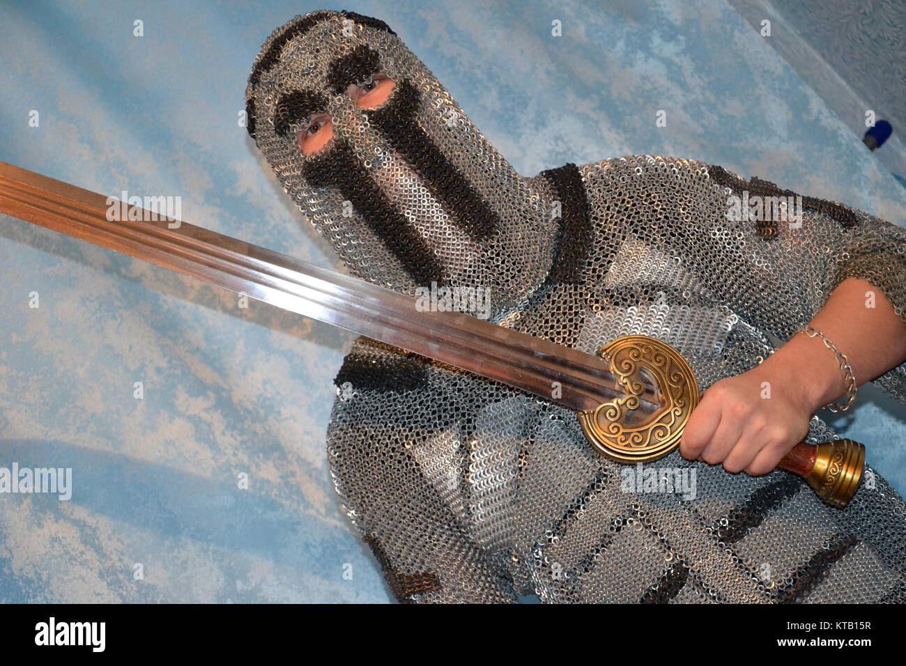 Knightly chain armor and sword Stock Photo - Alamy