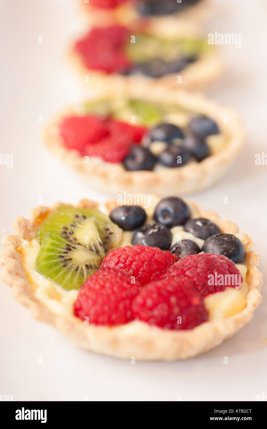 Raspberry blueberry strawberry and kiwi fruit tarts Stock Photo - Alamy