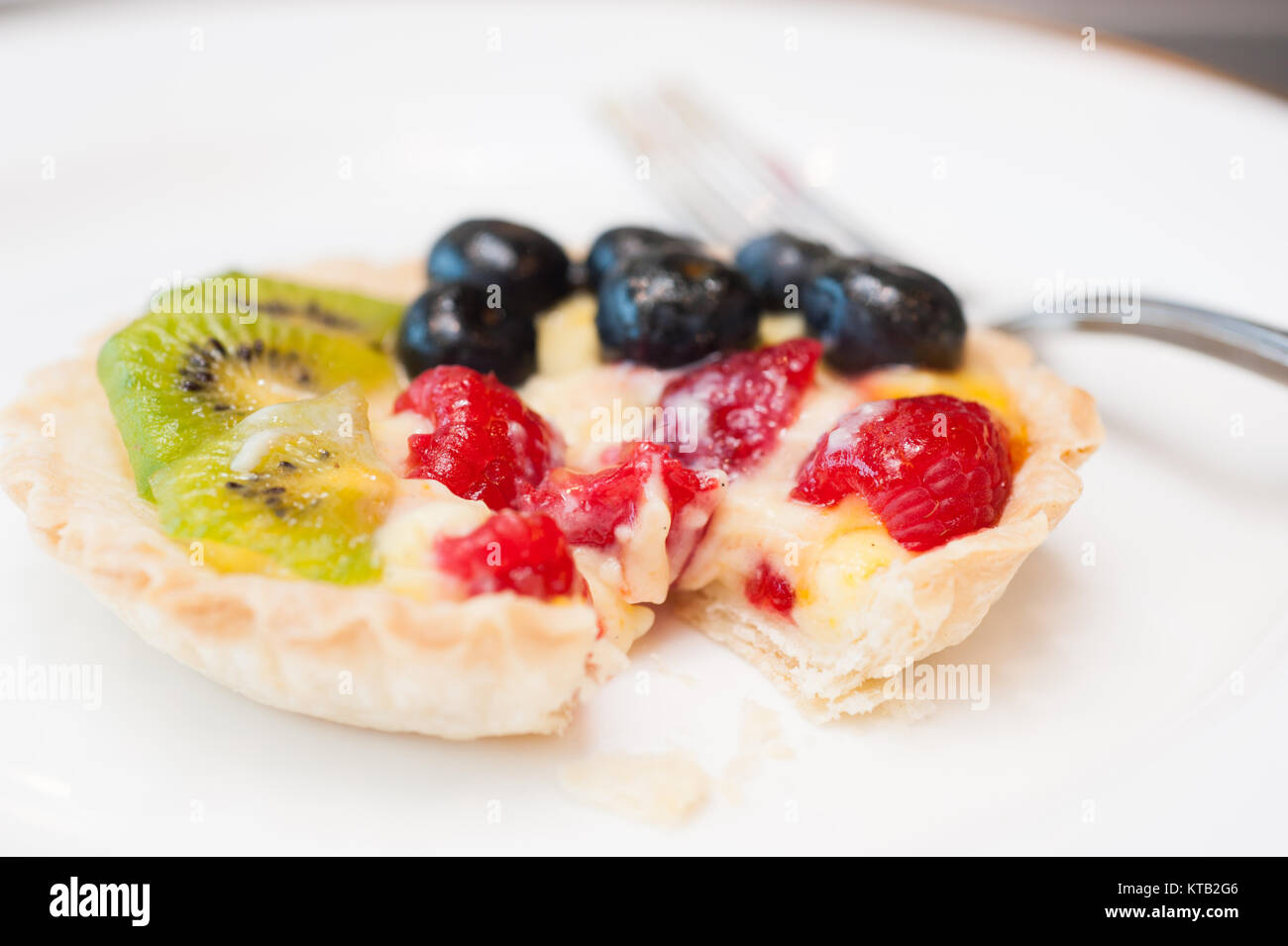Raspberry blueberry strawberry and kiwi fruit tarts Stock Photo - Alamy