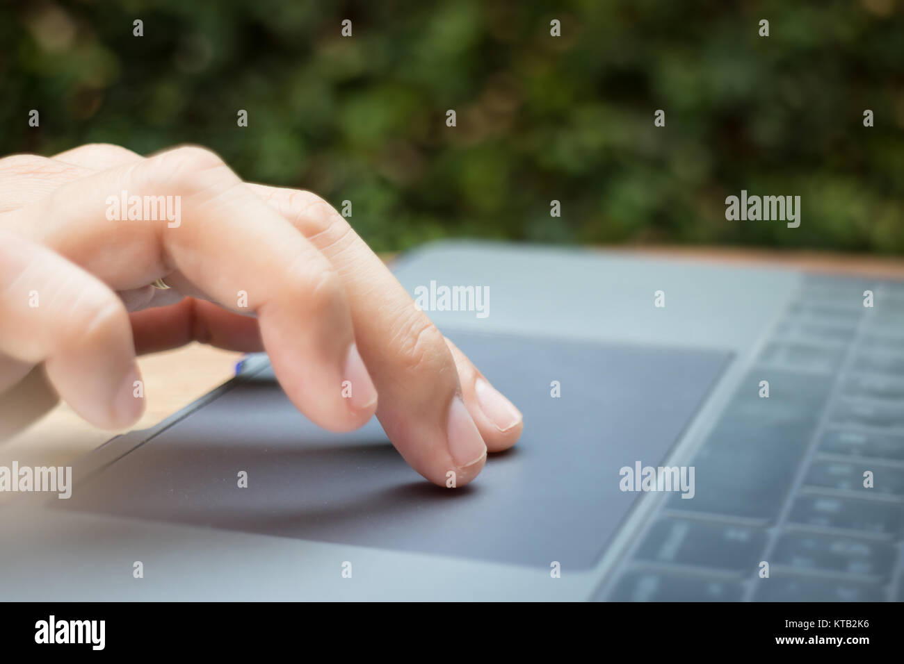 Woman Hand Using Laptop Touchpad Stock Photo - Alamy