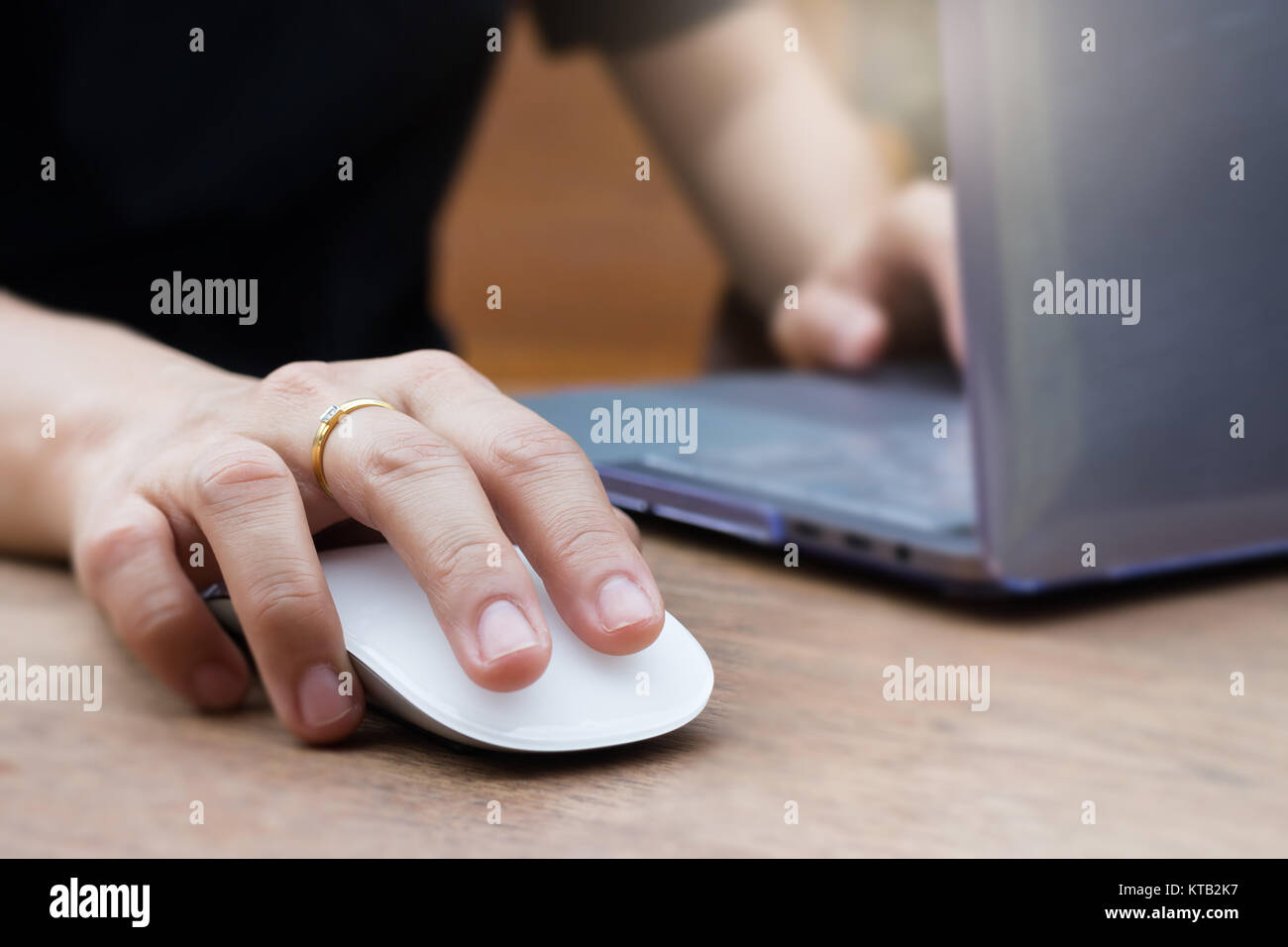 Woman Hands Using Laptop and Wireless Mouse Stock Photo - Alamy