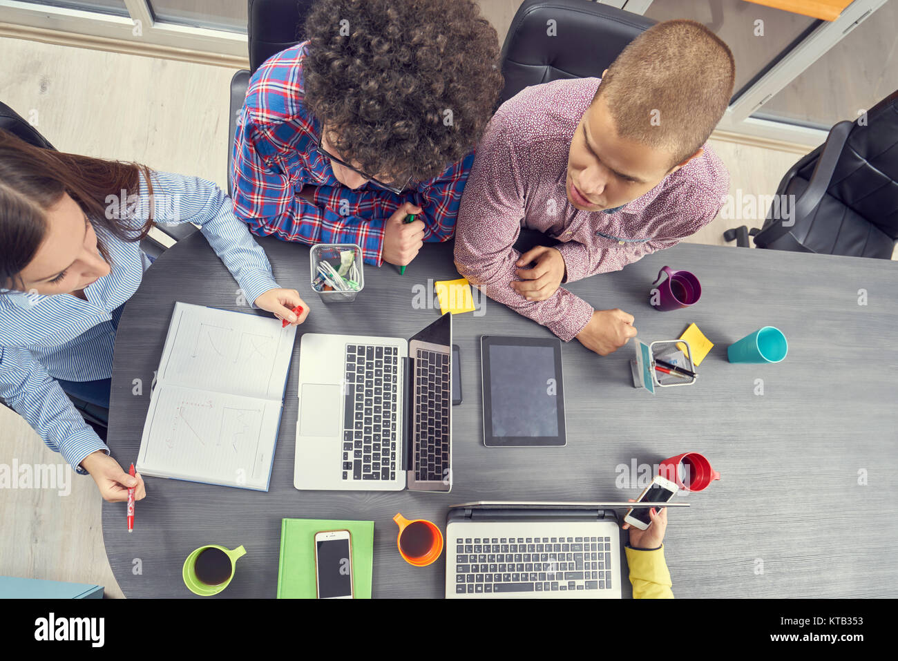 Portrait of startup group of creative people having a meeting with a ...