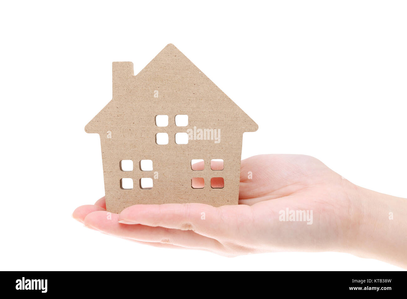 Miniature model of house on the hand, isolated on white background ...
