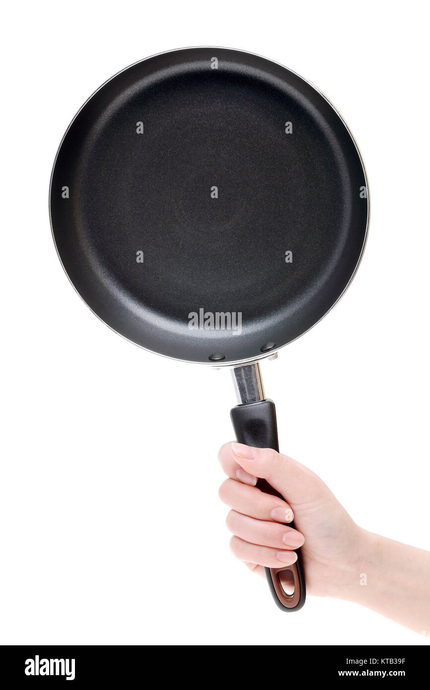 Hand holding frying pan isolated on a white background Stock Photo - Alamy