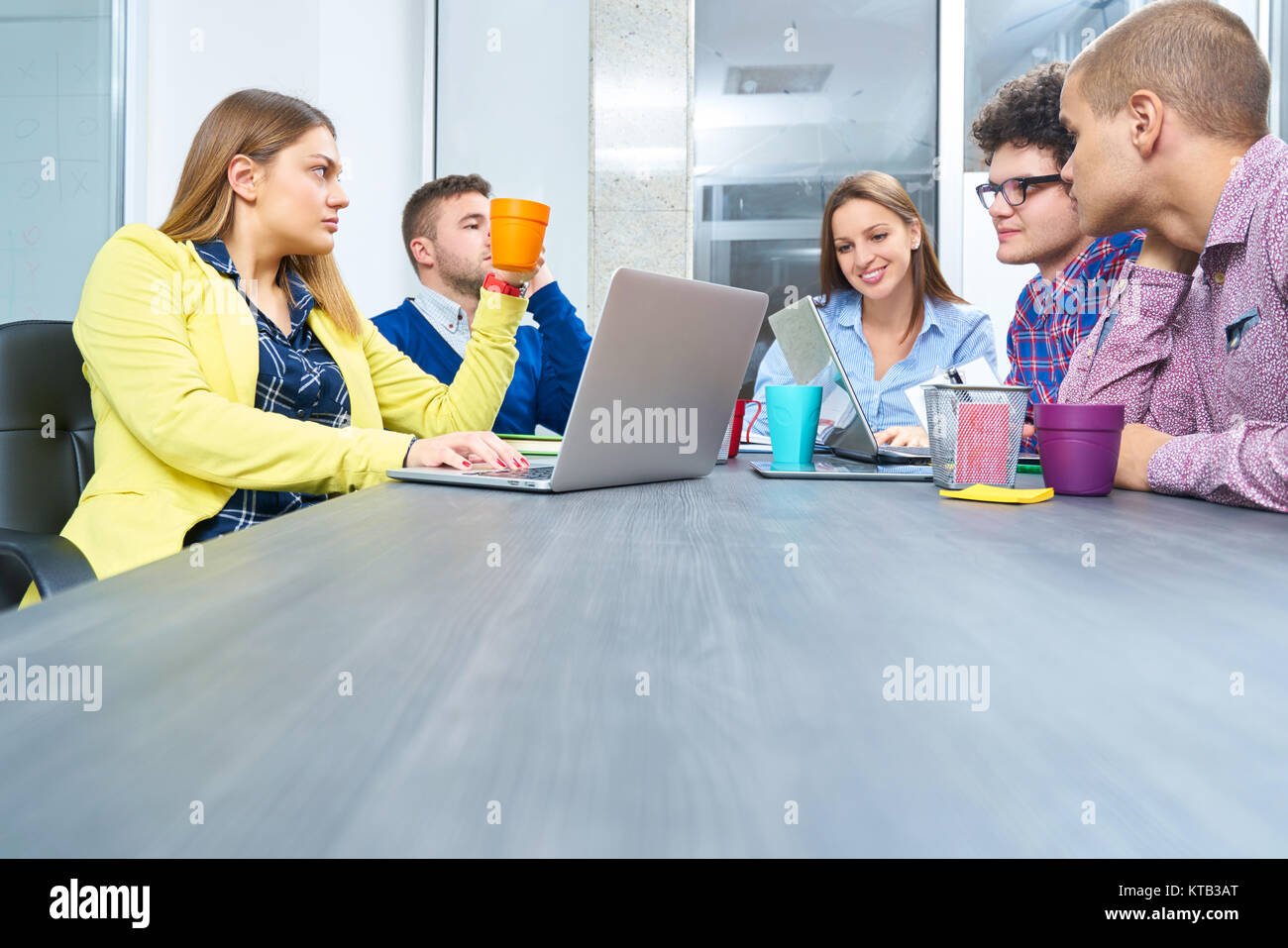 Portrait of startup group of creative people having a meeting with a ...