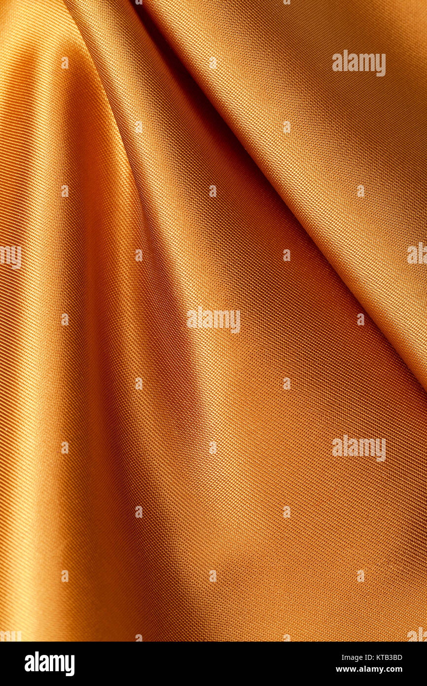 Silk background, texture of yellow shiny fabric, close up Stock Photo ...