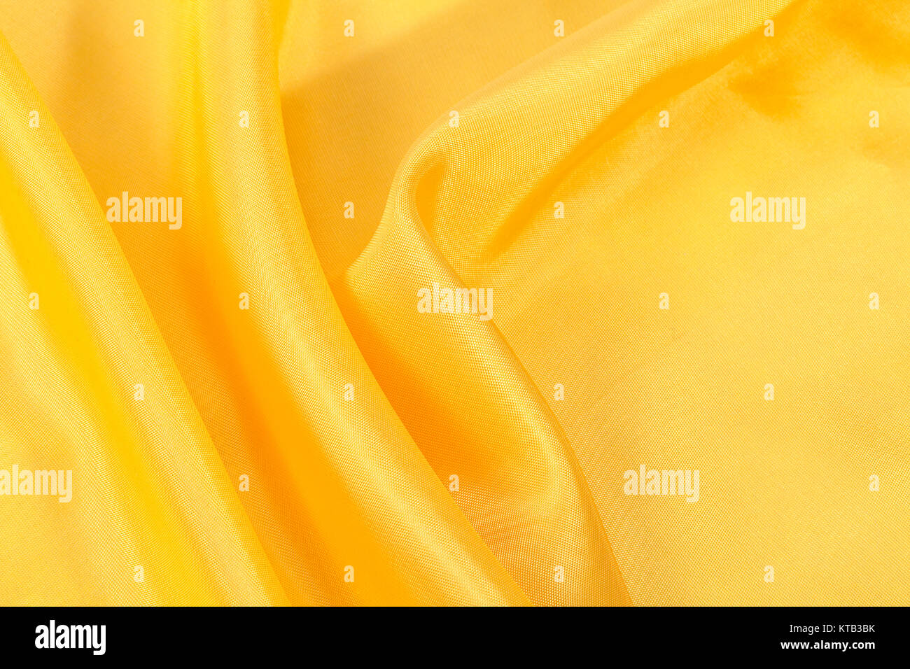 Silk background, texture of yellow shiny fabric Stock Photo - Alamy