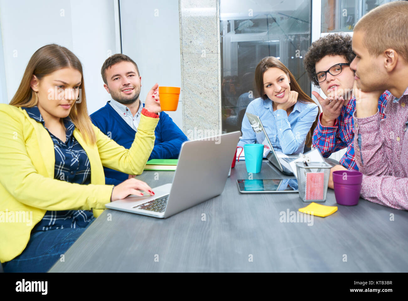 Portrait of startup group of creative people having a meeting with a ...