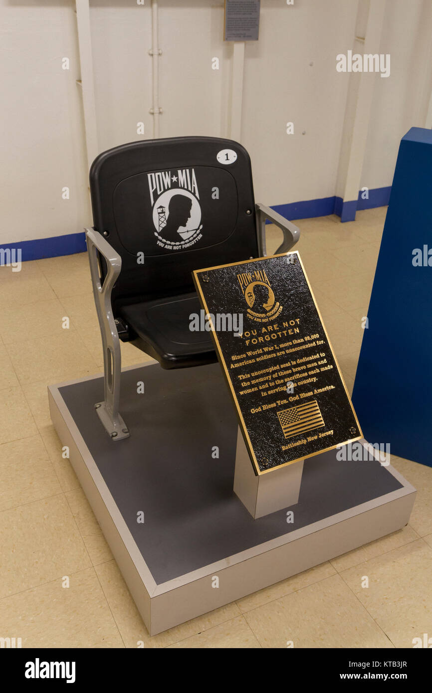 Unoccupied seat memorial chair to POW and MIA soldiers on the USS New ...