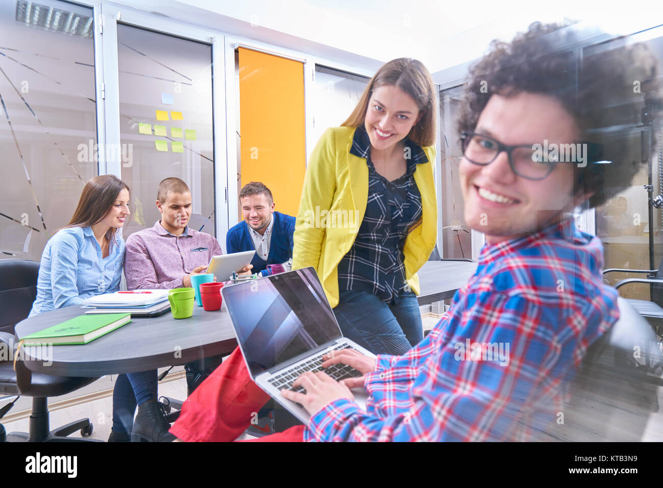 Portrait of startup group of creative people having a meeting with a ...