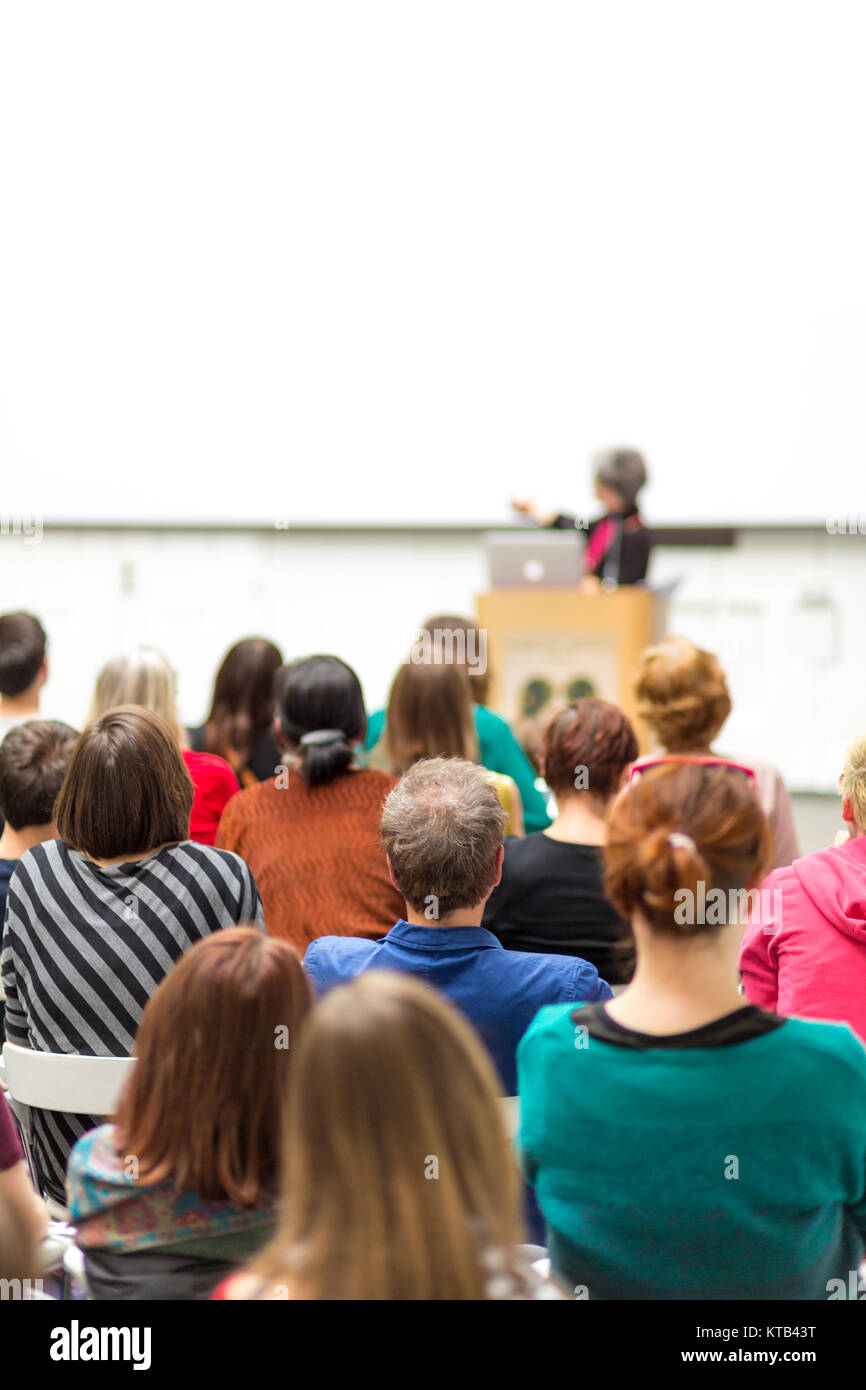 Woman giving presentation on business conference Stock Photo - Alamy