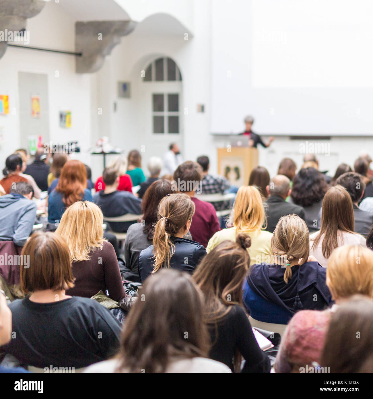Woman giving presentation on business conference Stock Photo - Alamy