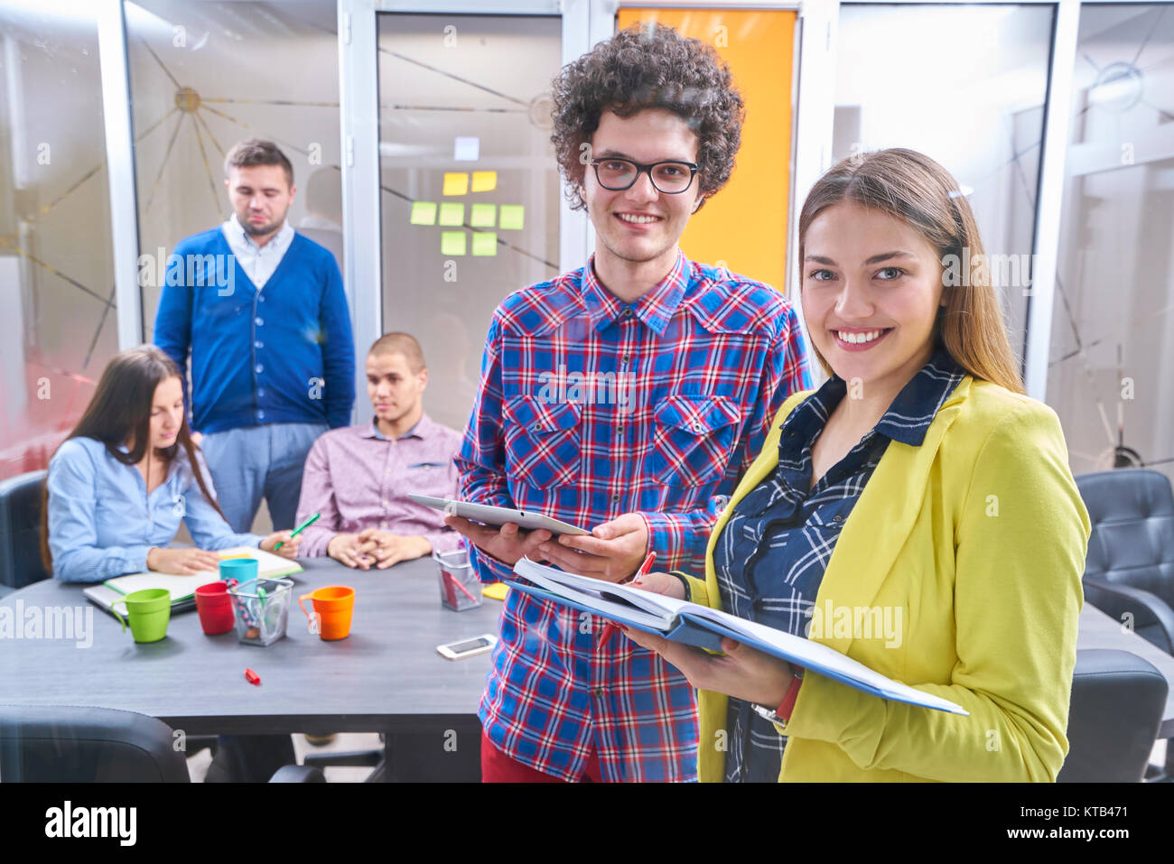 Portrait of startup group of creative people having a meeting with a ...