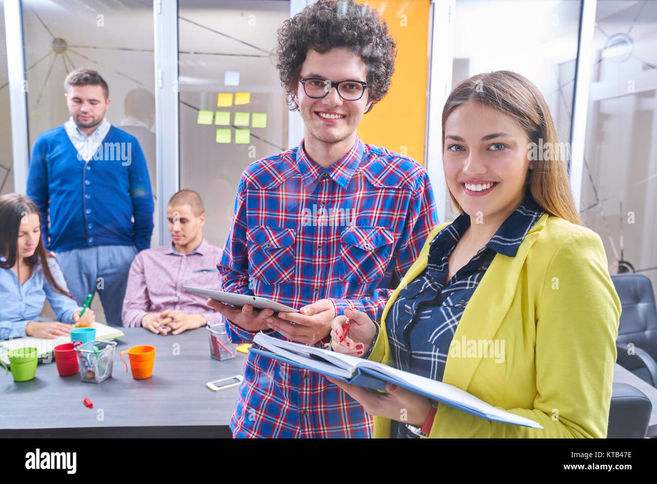 Portrait of startup group of creative people having a meeting with a ...