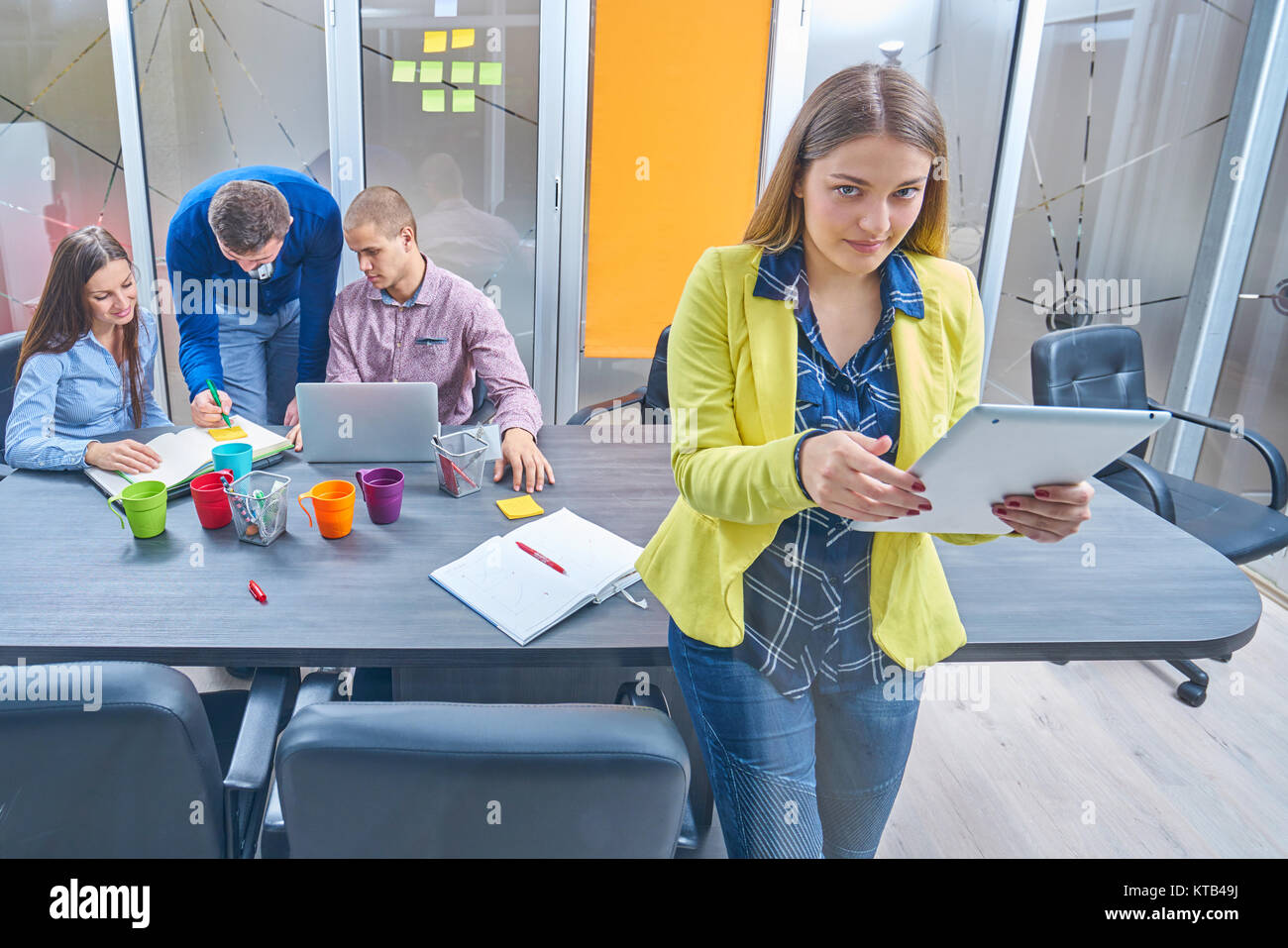 Portrait of startup group of creative people having a meeting with a ...