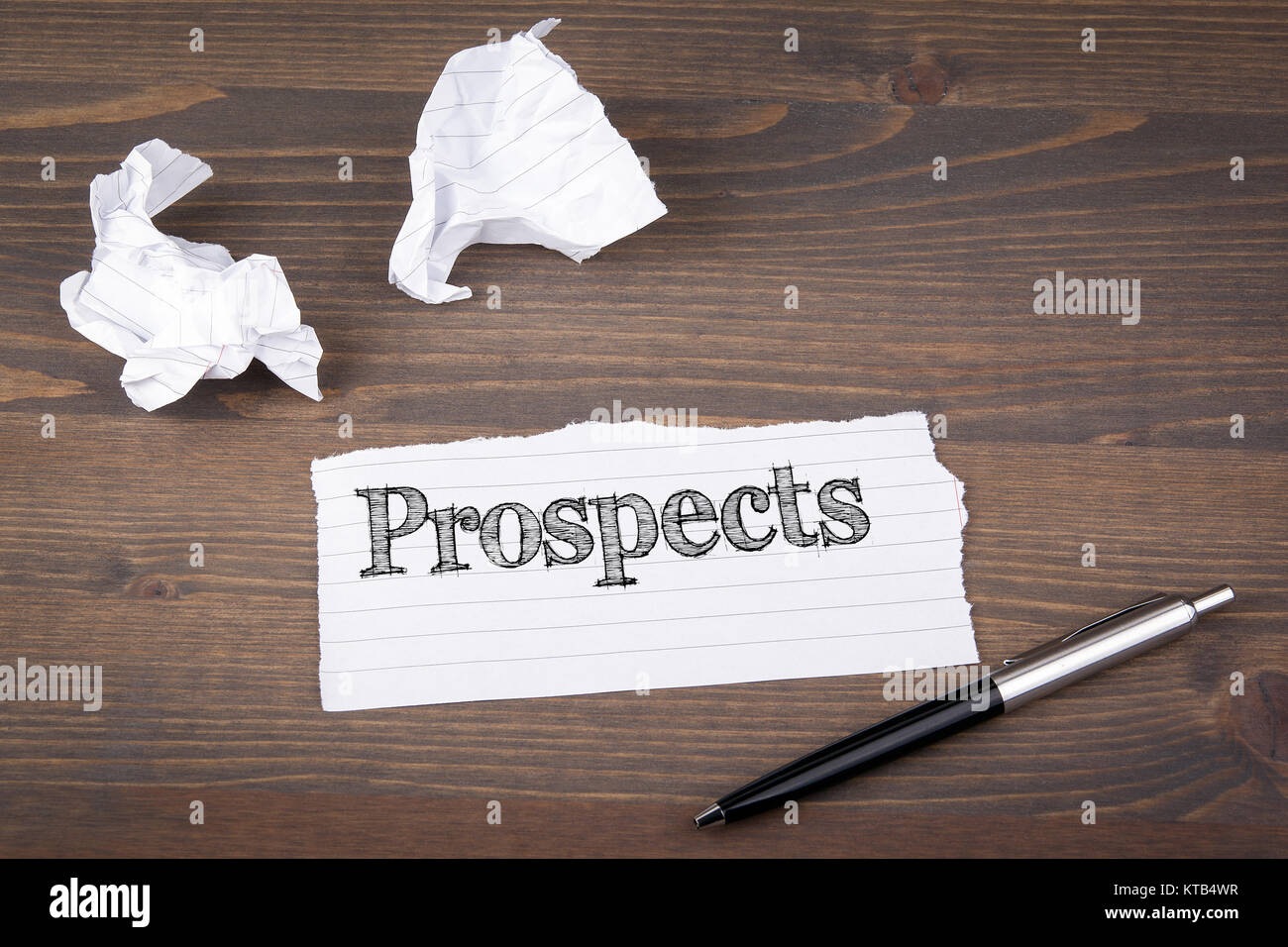Prospects. paper sheet from the booklet on the wooden table Stock Photo ...