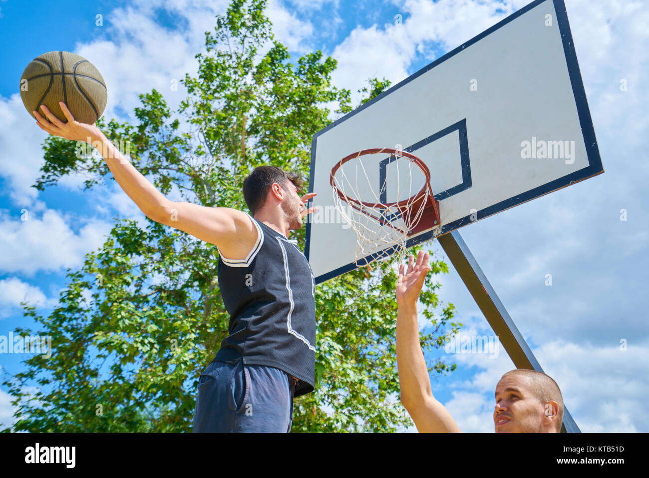 Young boys playing basketball Stock Photo - Alamy
