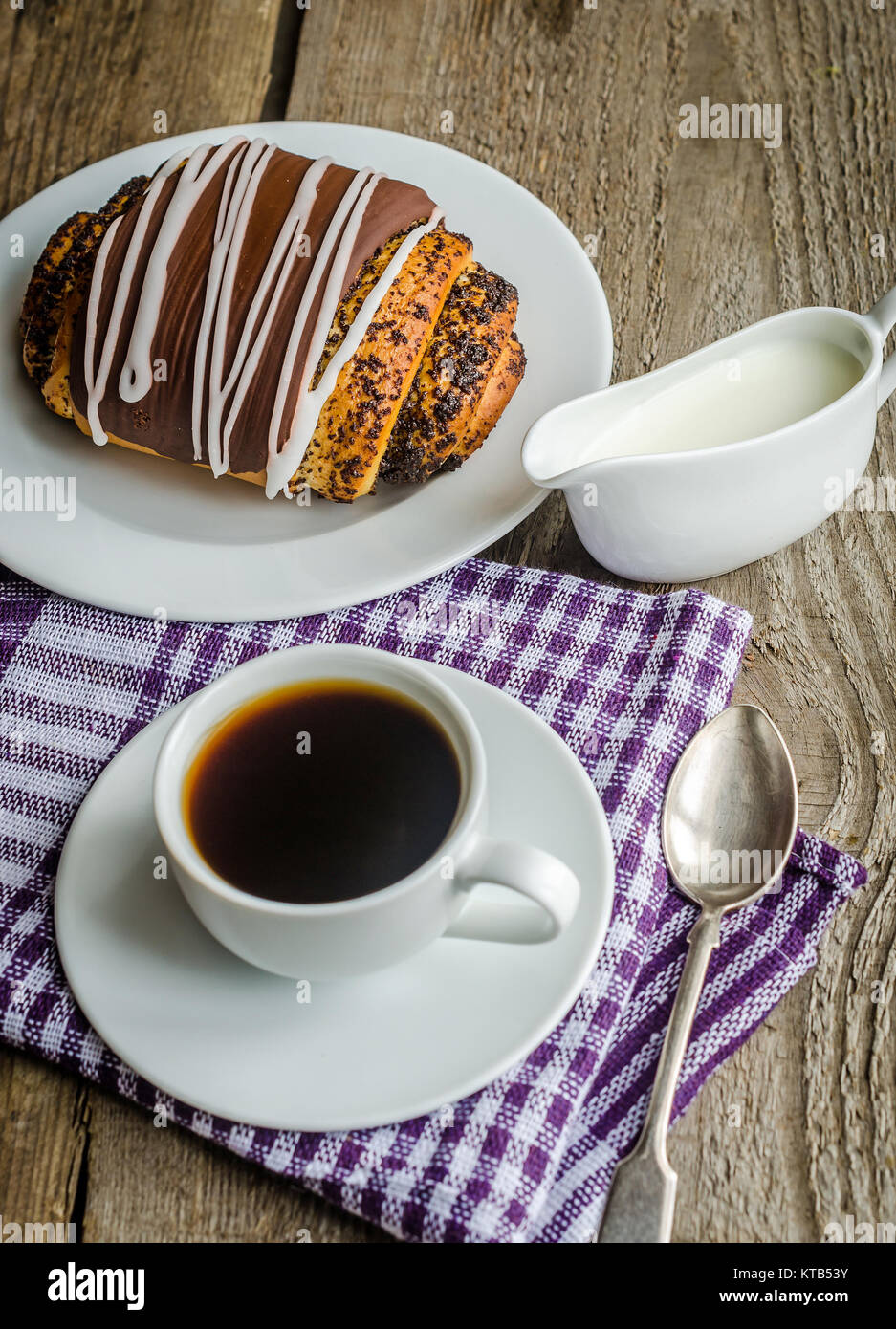 poppy bun glazed with ganache Stock Photo - Alamy